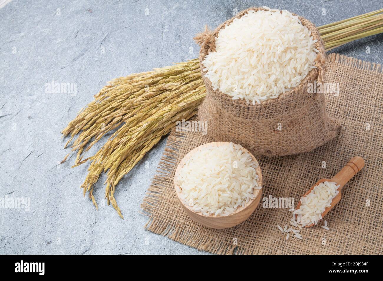 thai fragrant jasmine rice in a bowl with gold spike on Sack Stock ...