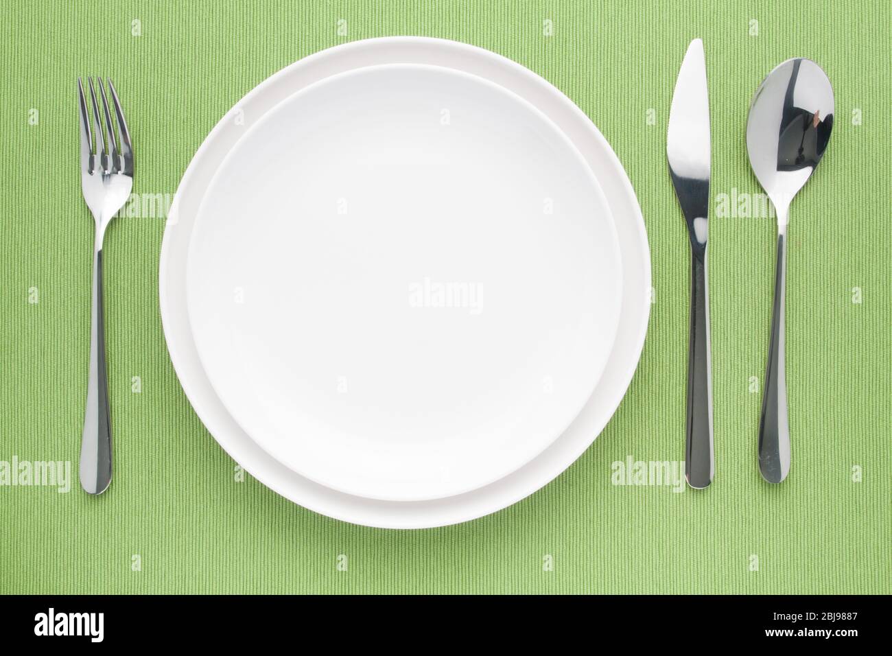 platein table knife and fork spoon on napery Stock Photo - Alamy