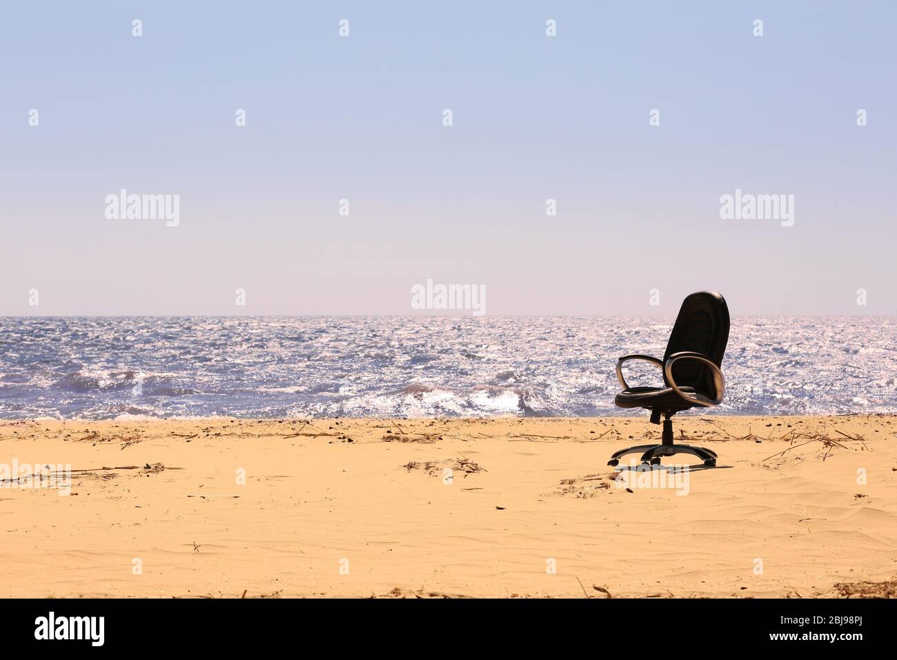 An office chair on the beach Stock Photo - Alamy