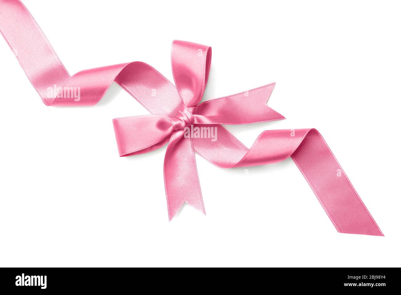 Pink ribbon with bow on white background Stock Photo - Alamy