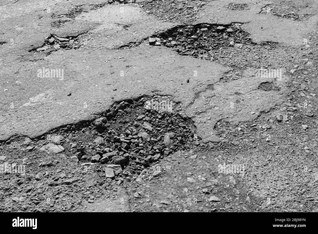 Damaged asphalt pavement road Stock Photo - Alamy Damaged asphalt pavement road Stock Photo - Alamy