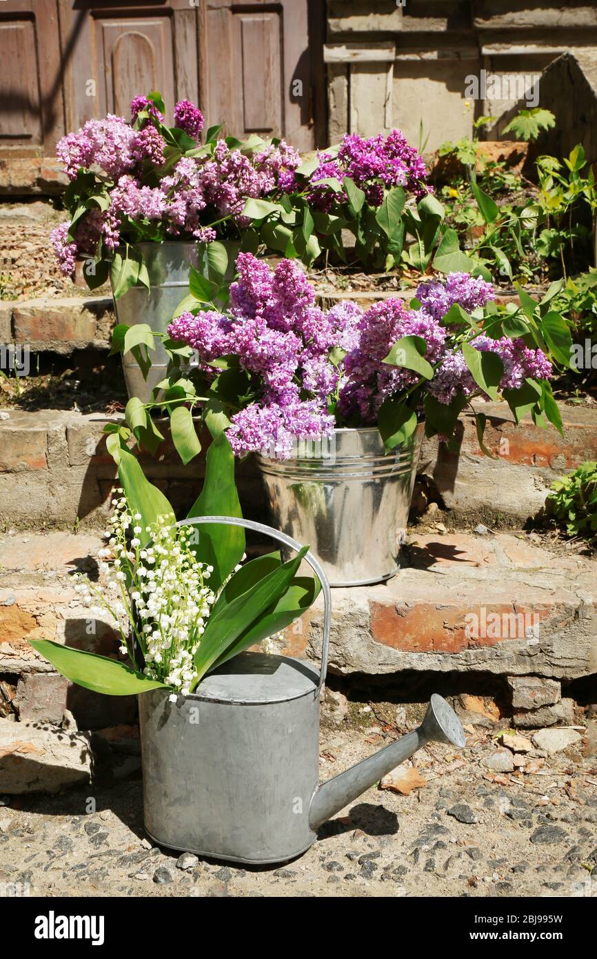 Bouquets of spring flowers on porch Stock Photo - Alamy