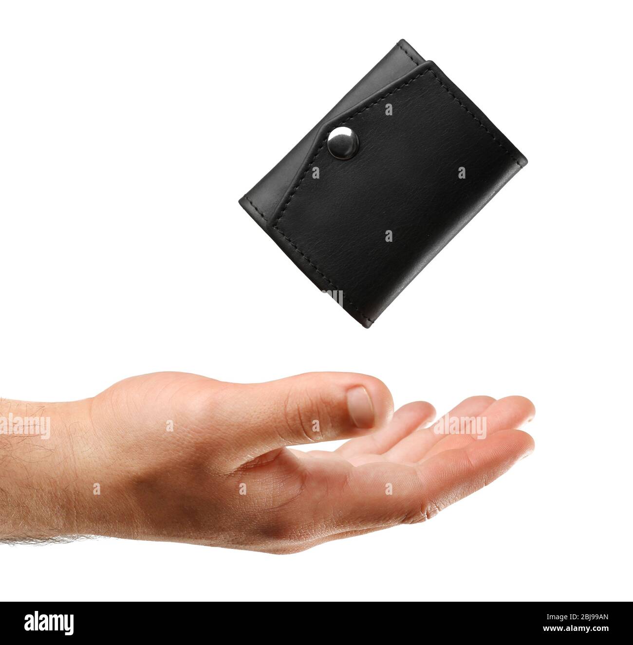 Man hand catching wallet on light background Stock Photo - Alamy