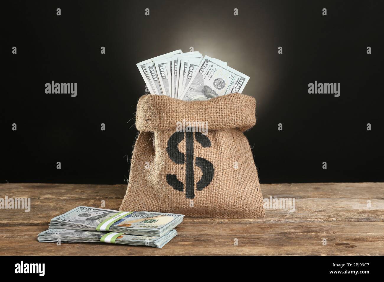 Money bag on dark background Stock Photo - Alamy