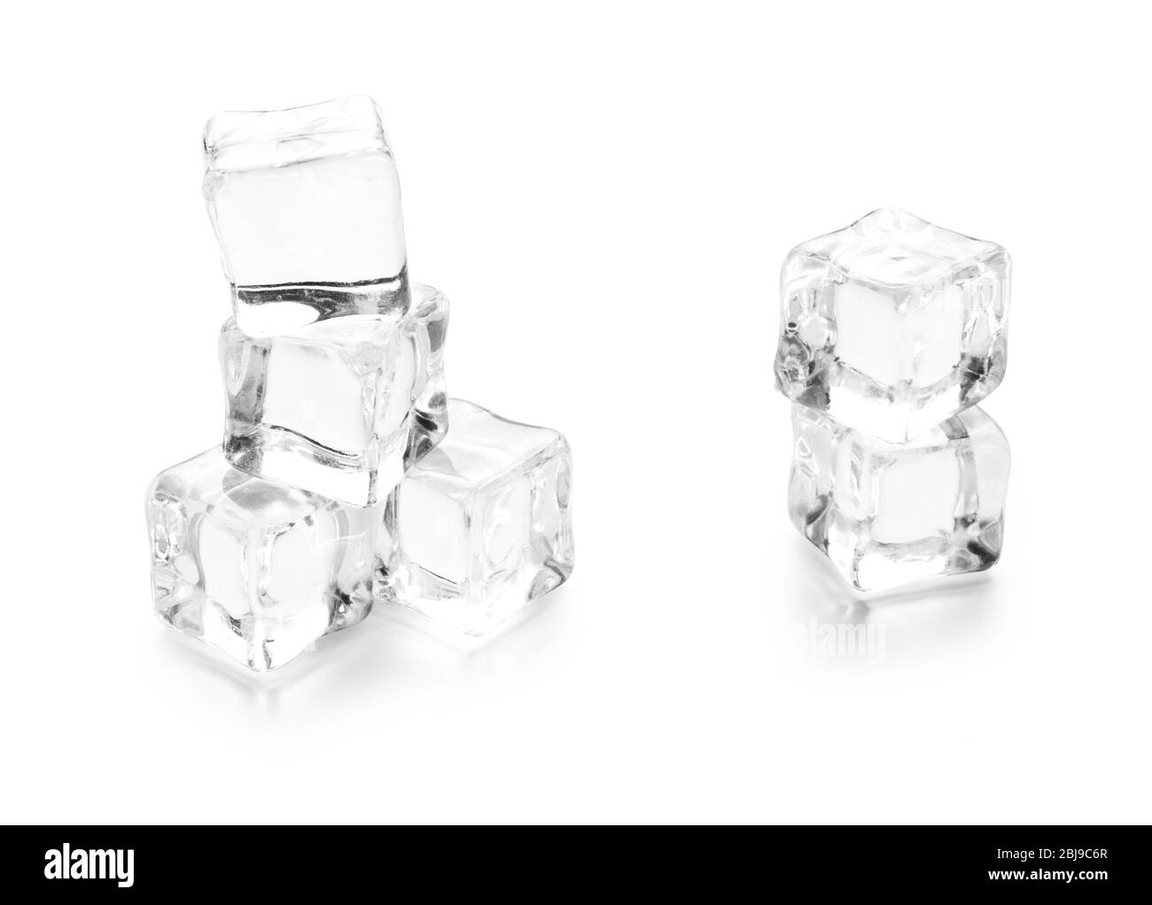 three ice cubes on white background Stock Photo - Alamy