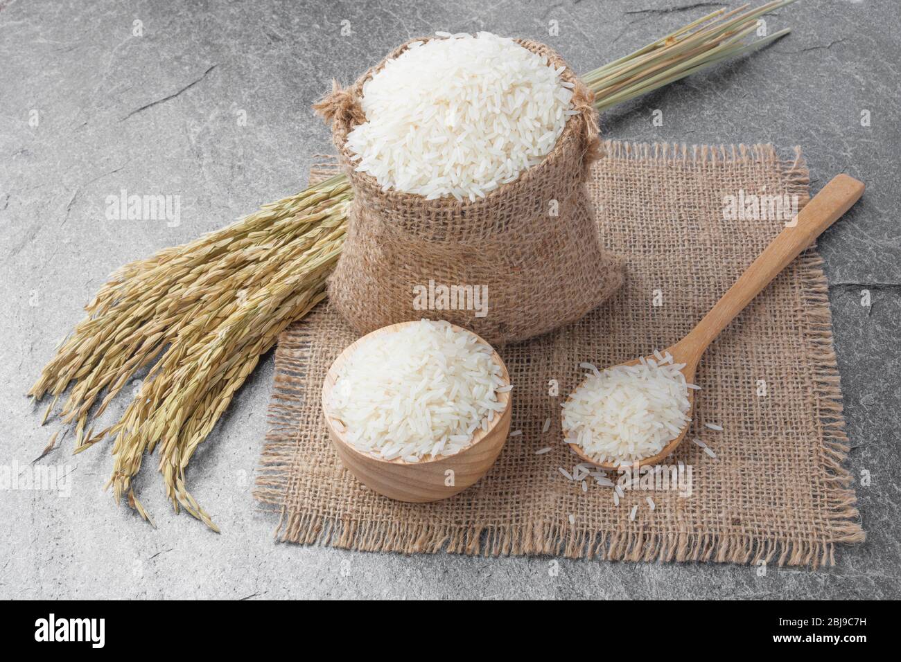 thai fragrant jasmine rice in a bowl with gold spike on Sack Stock ...