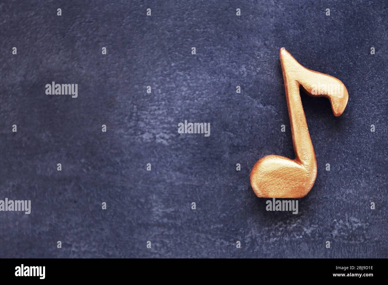 Music note on dark grey background Stock Photo - Alamy