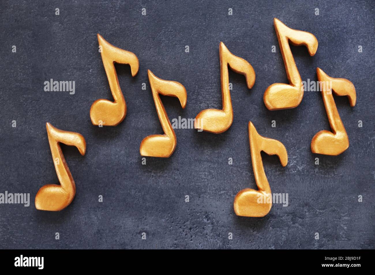 Music notes on dark grey background Stock Photo - Alamy
