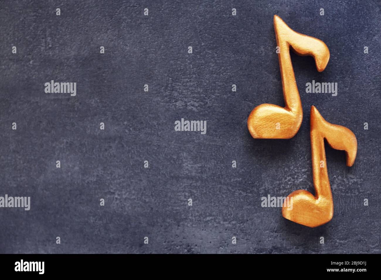 Music notes on dark grey background Stock Photo - Alamy