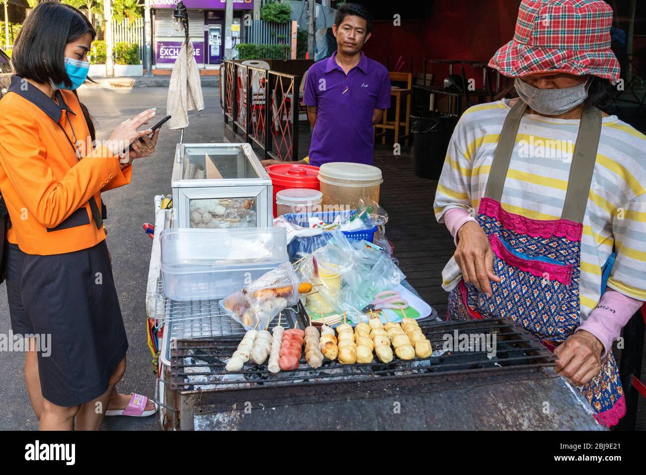 Street vendor selling food to customer in Soi Cowboy during Covid 19 ...