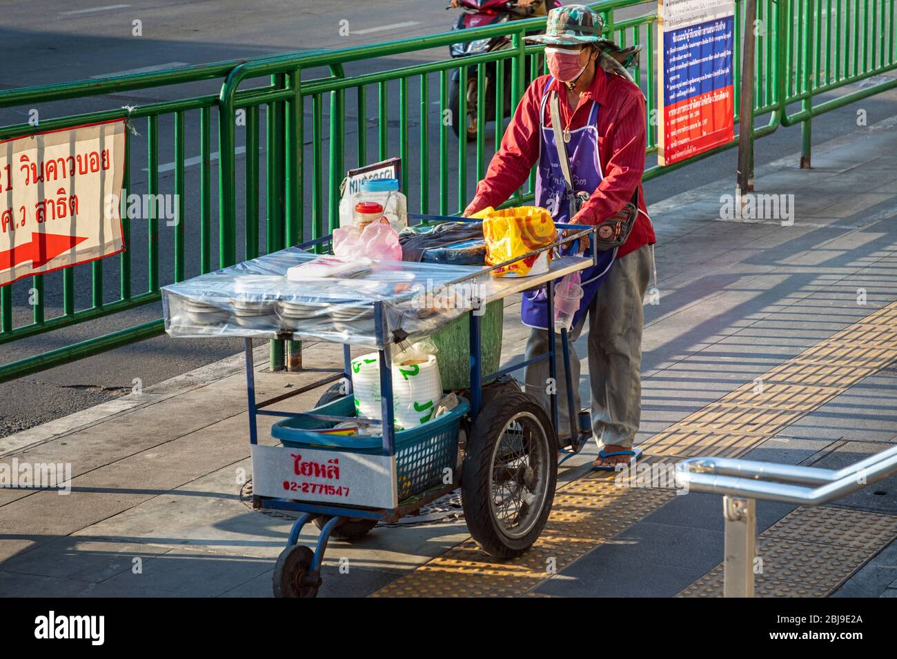 Thai food vendor with face mask and pushcart during Covid 19 pandemic ...