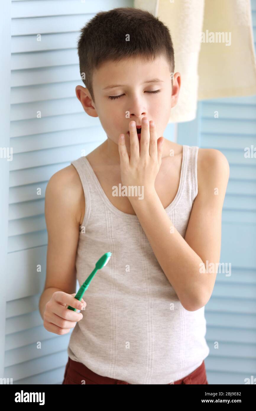 Schoolboy cleaning teeth hi-res stock photography and images - Alamy