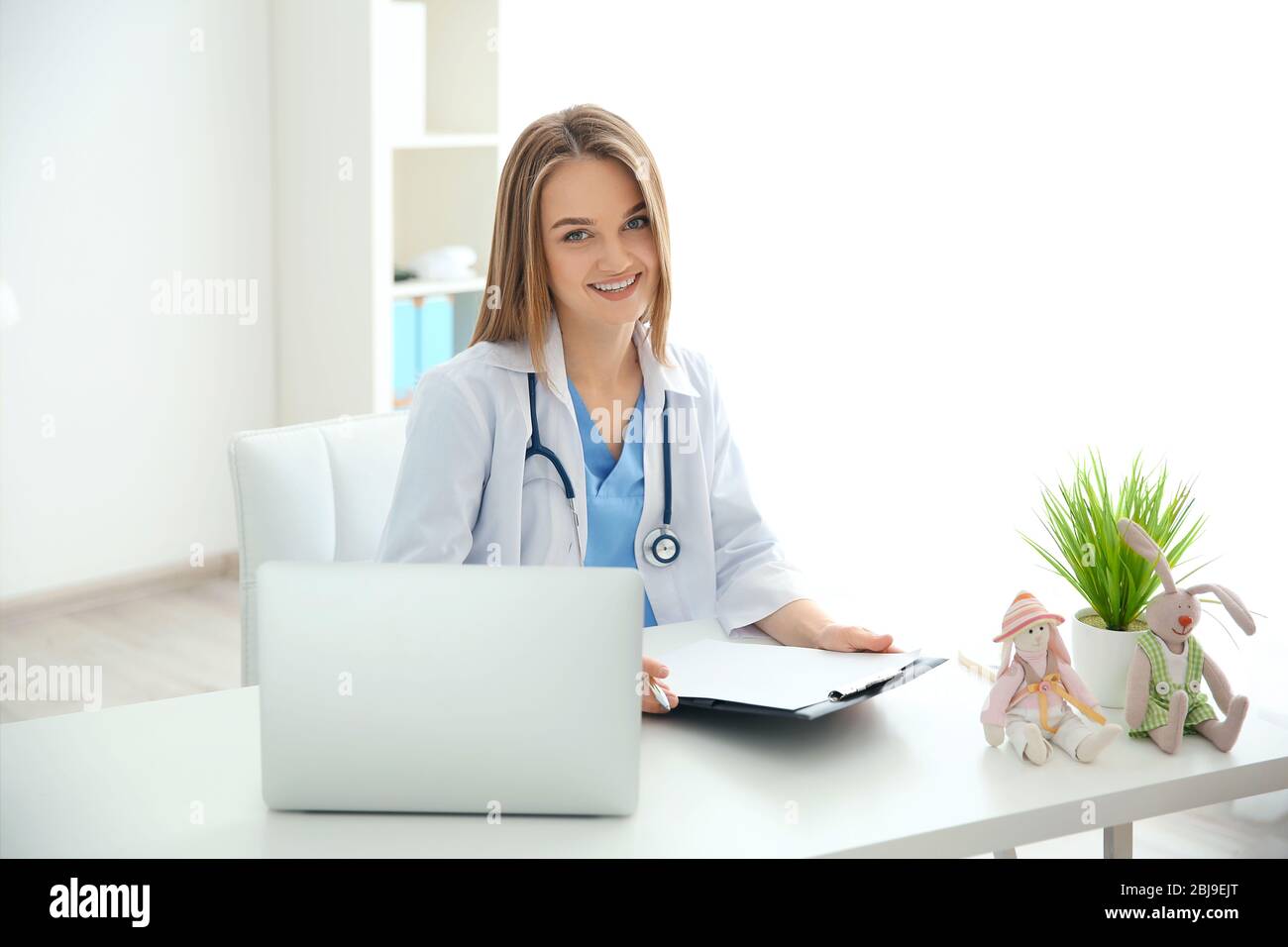 Young beautiful female doctor working at the office Stock Photo - Alamy