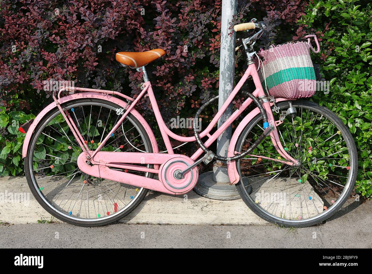 Pink bicycle outdoors Stock Photo - Alamy