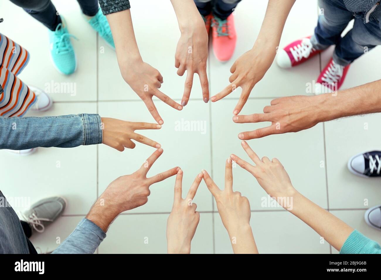 Teamwork concept. United hands, top view Stock Photo - Alamy