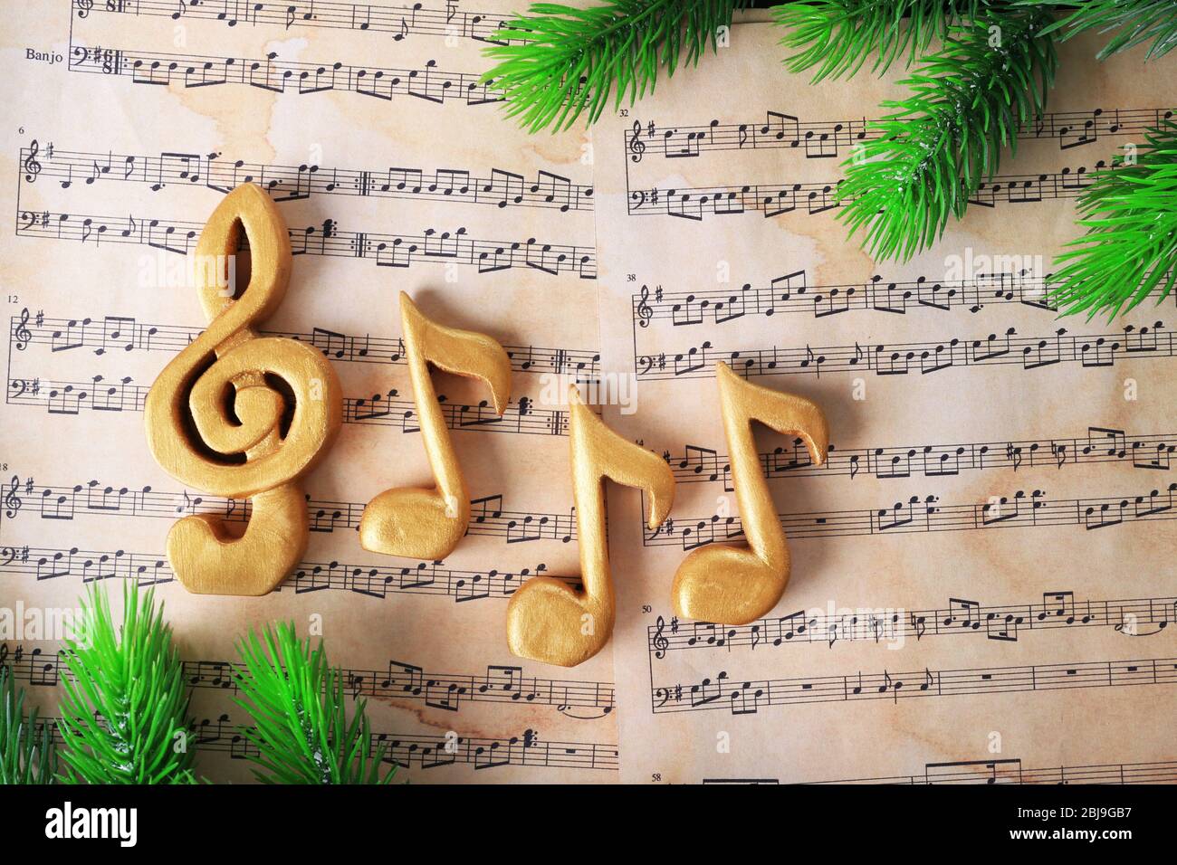 Christmas treble clef and music notes on paper background Stock Photo ...