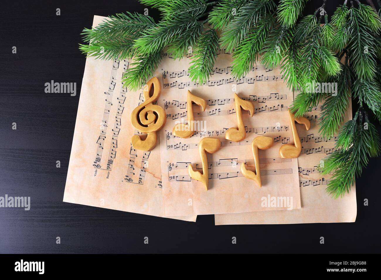 Christmas treble clef and music notes on paper background Stock Photo ...