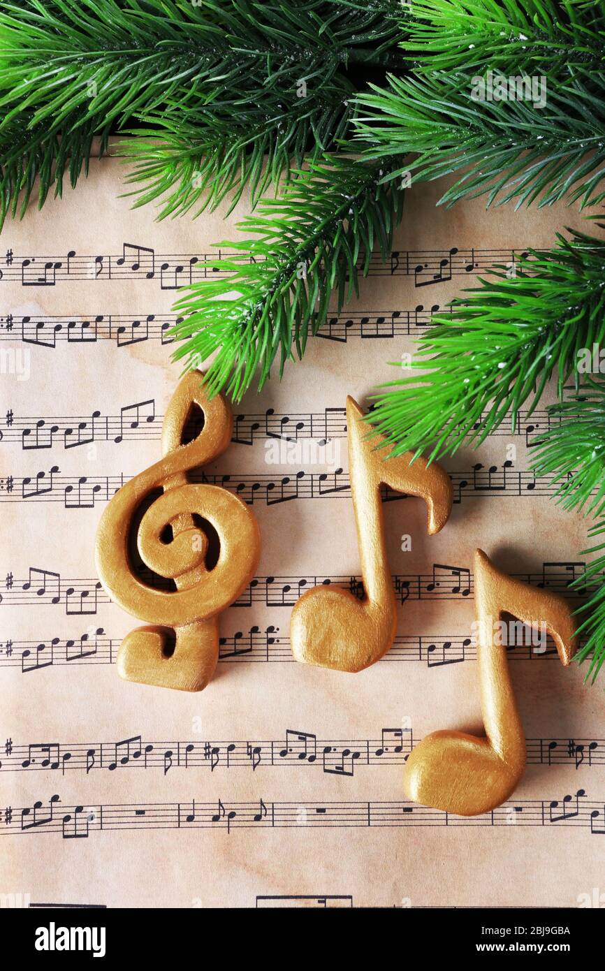 Christmas treble clef and music notes on paper background Stock Photo ...