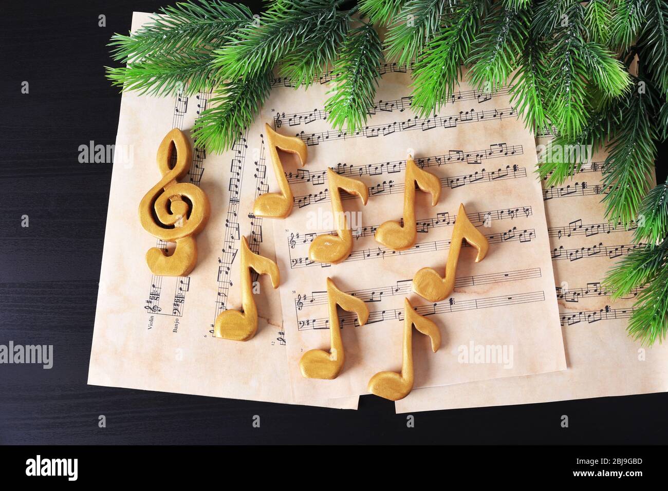 Christmas treble clef and music notes on paper background Stock Photo ...