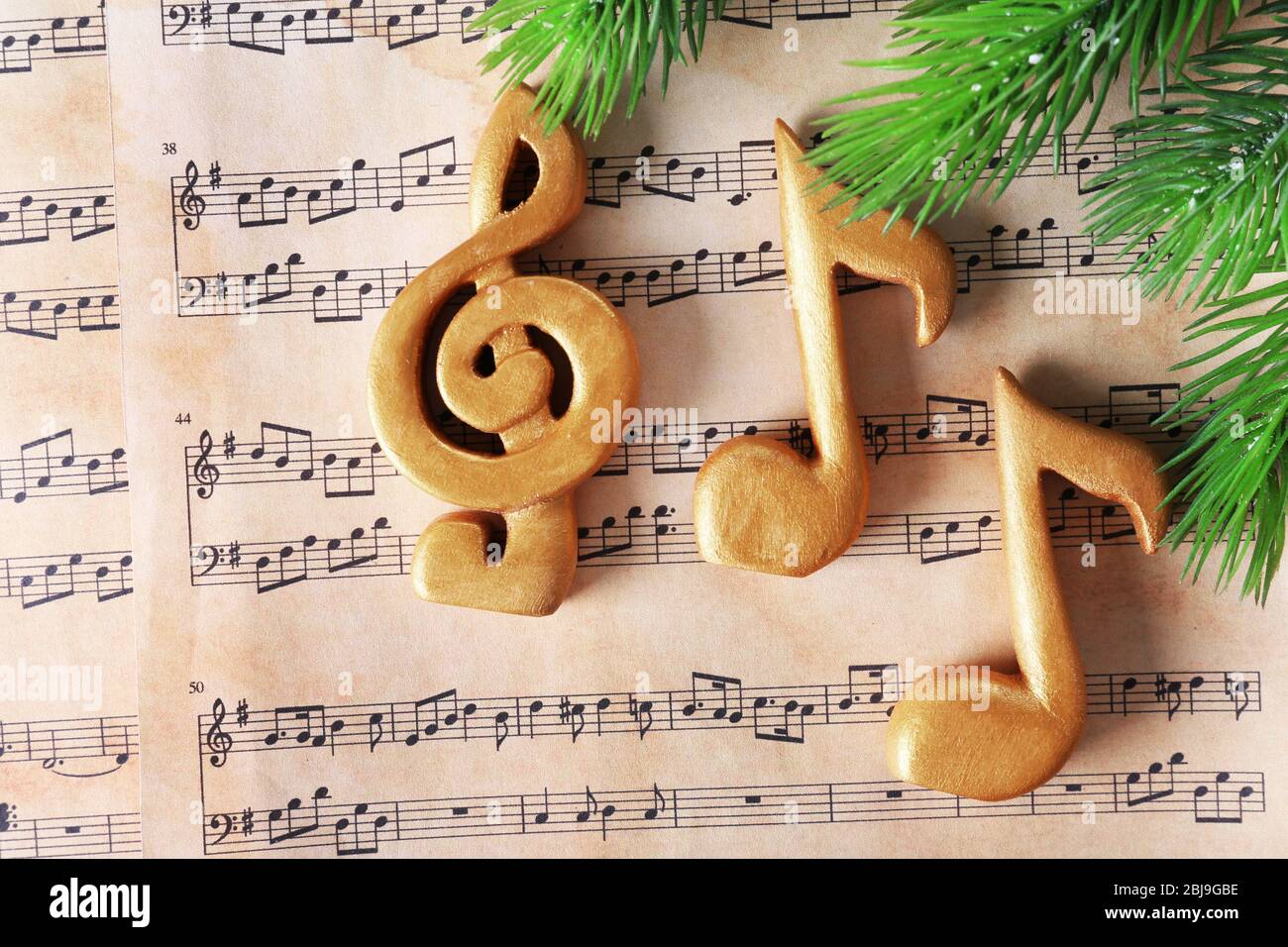 Christmas treble clef and music notes on paper background Stock Photo ...