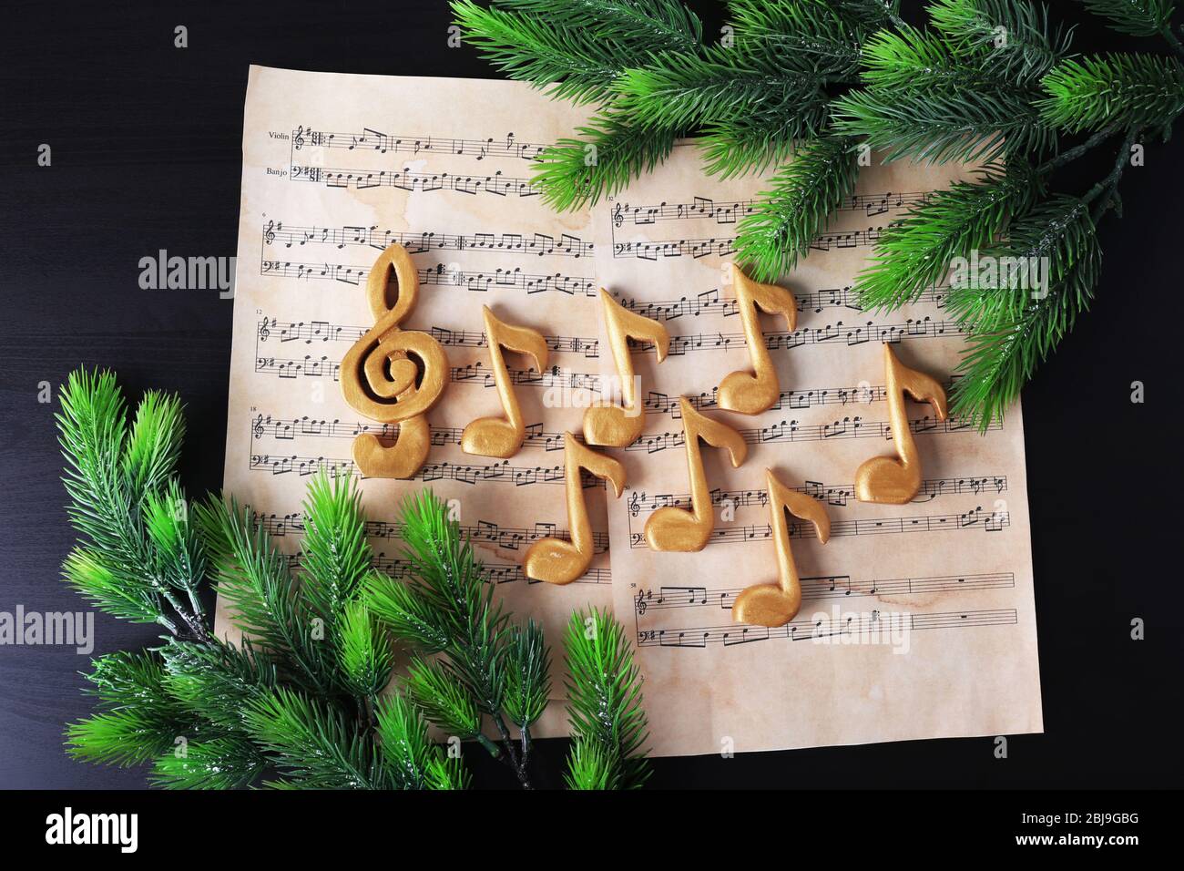 Christmas treble clef and music notes on paper background Stock Photo ...