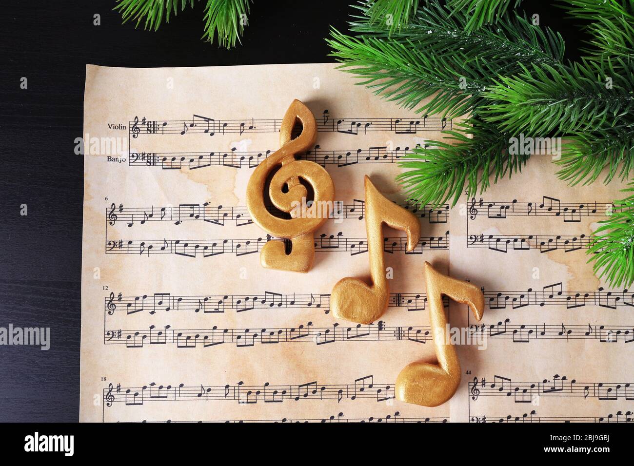 Christmas treble clef and music notes on paper background Stock Photo ...