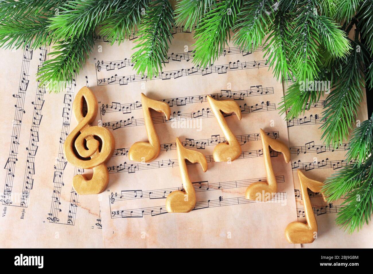 Christmas treble clef and music notes on paper background Stock Photo ...