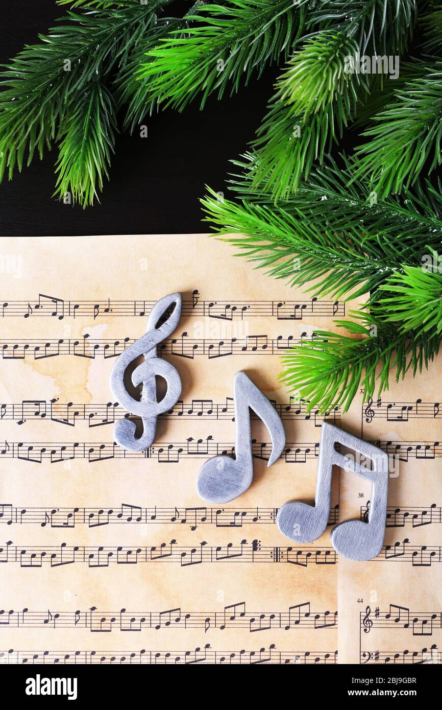 Christmas treble clef and music notes on paper background Stock Photo ...