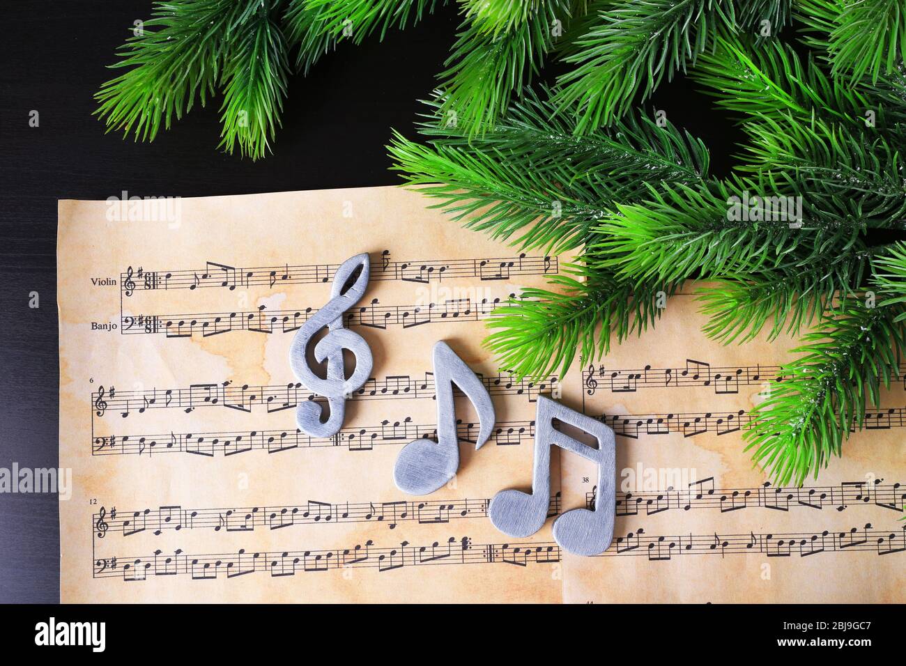 Christmas treble clef and music notes on paper background Stock Photo ...