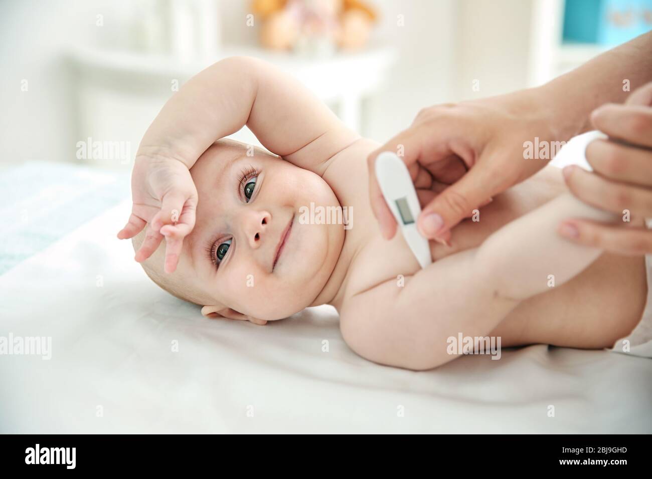 Taking temperature baby doctor hi-res stock photography and images - Alamy