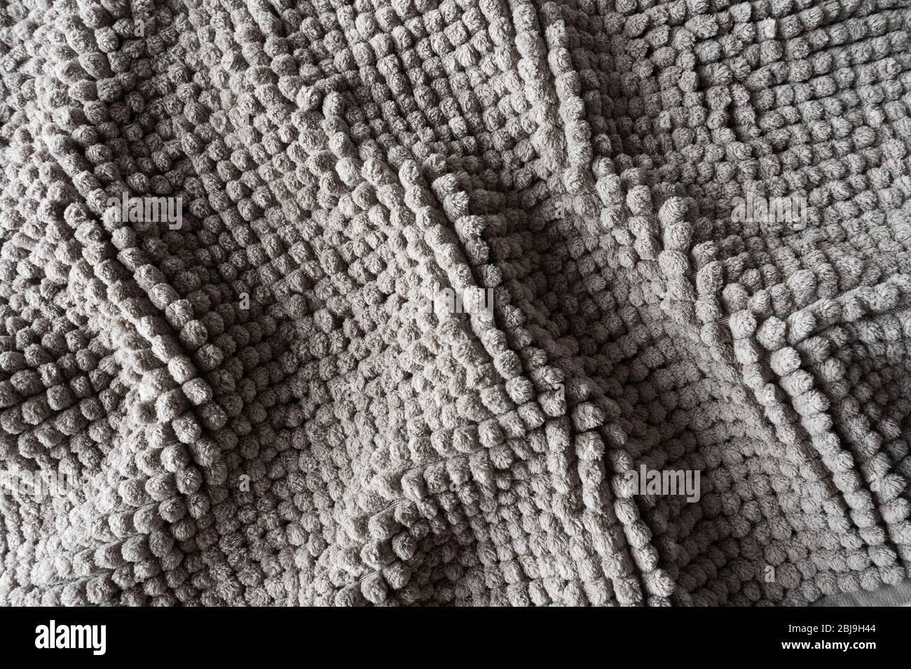 Texture of a gray blanket made of small balls Stock Photo - Alamy