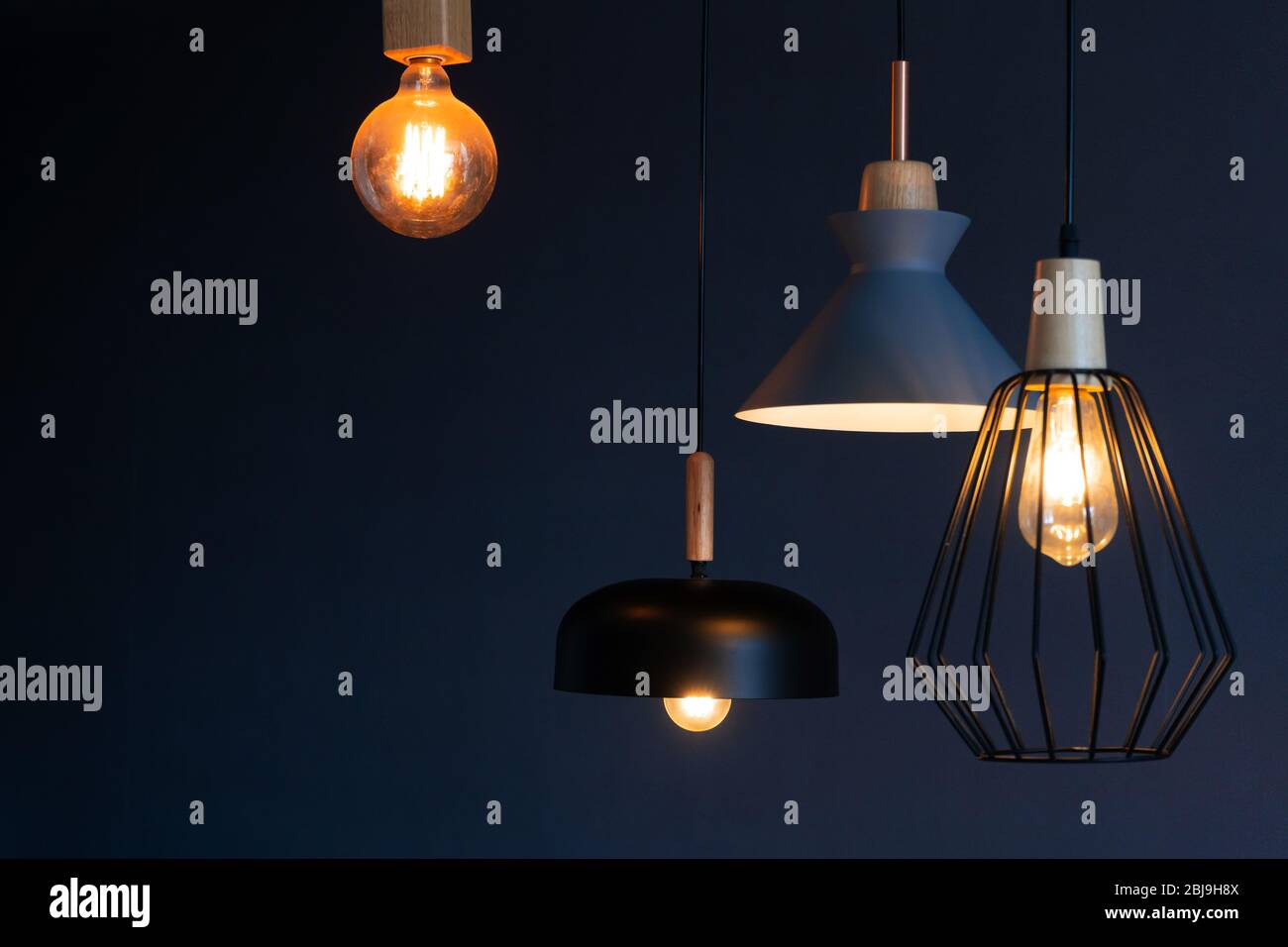 Interior decoration of stylish housing. Loft style incandescent lamp ...