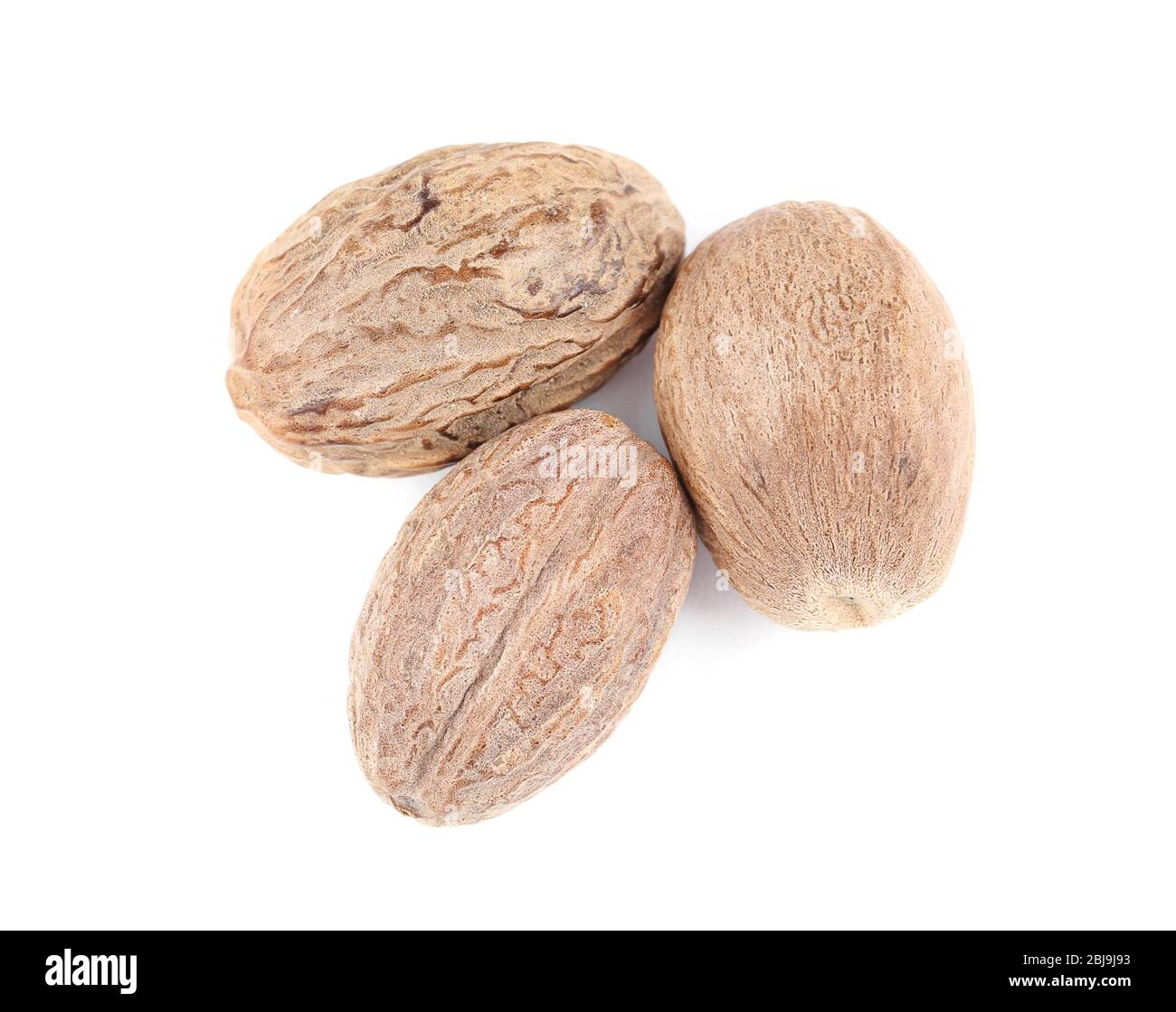 Nutmeg isolated on white Stock Photo - Alamy