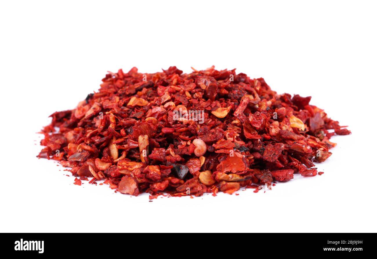 Dried chopped chili pepper isolated on white Stock Photo - Alamy