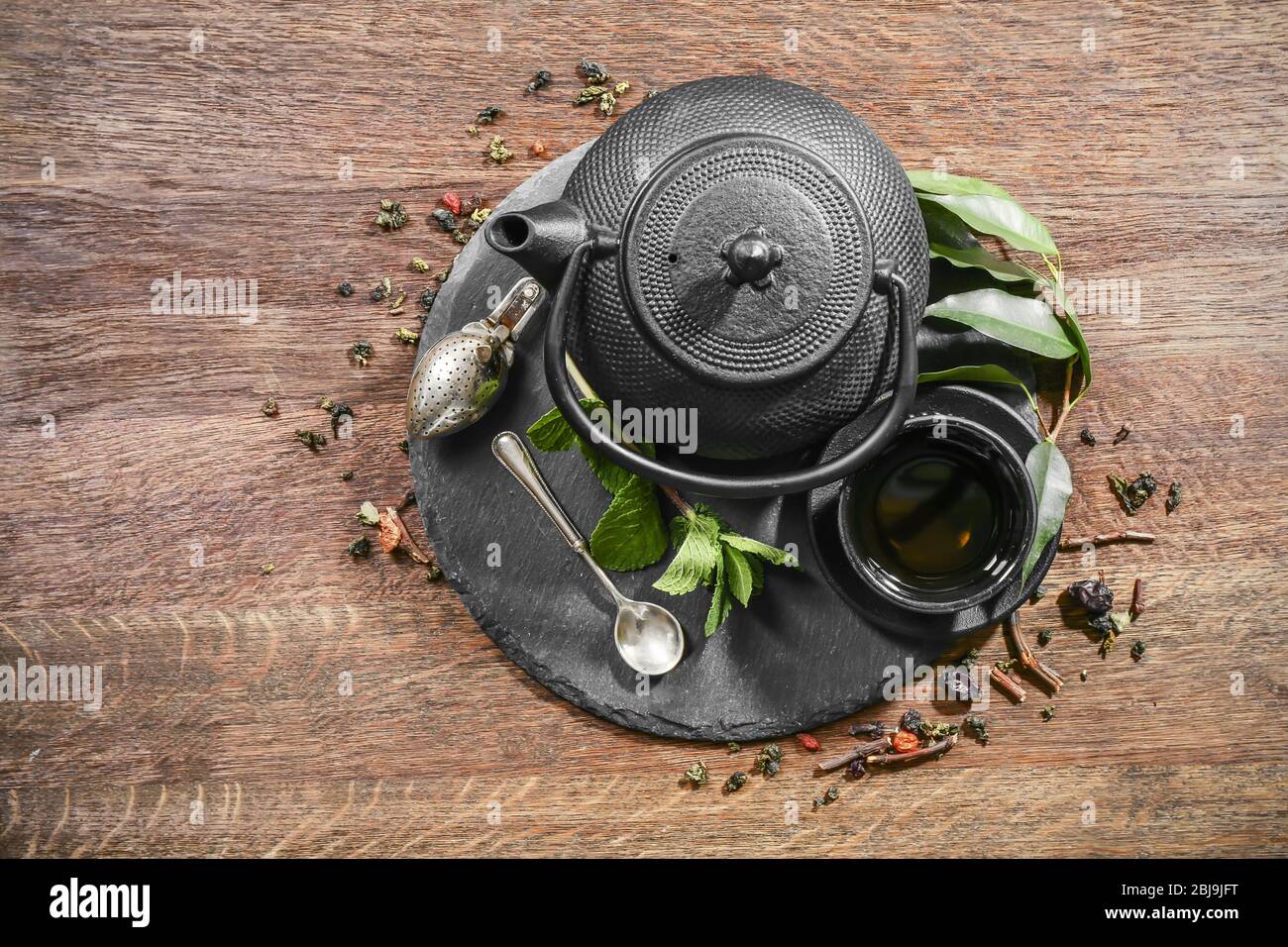Traditional eastern teapot and teacup on wooden desk Stock Photo - Alamy