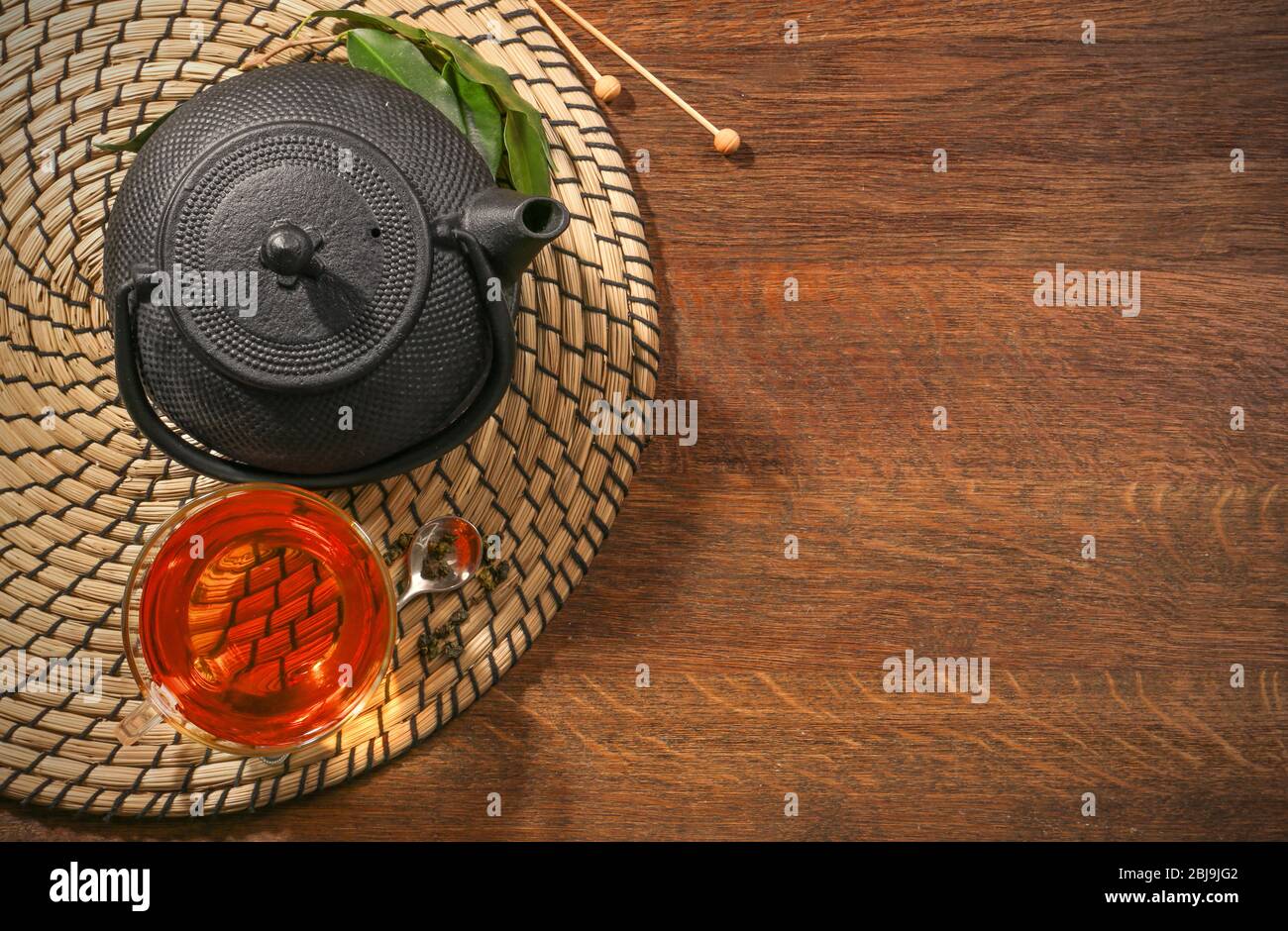 Traditional eastern teapot and teacup on wooden desk Stock Photo - Alamy