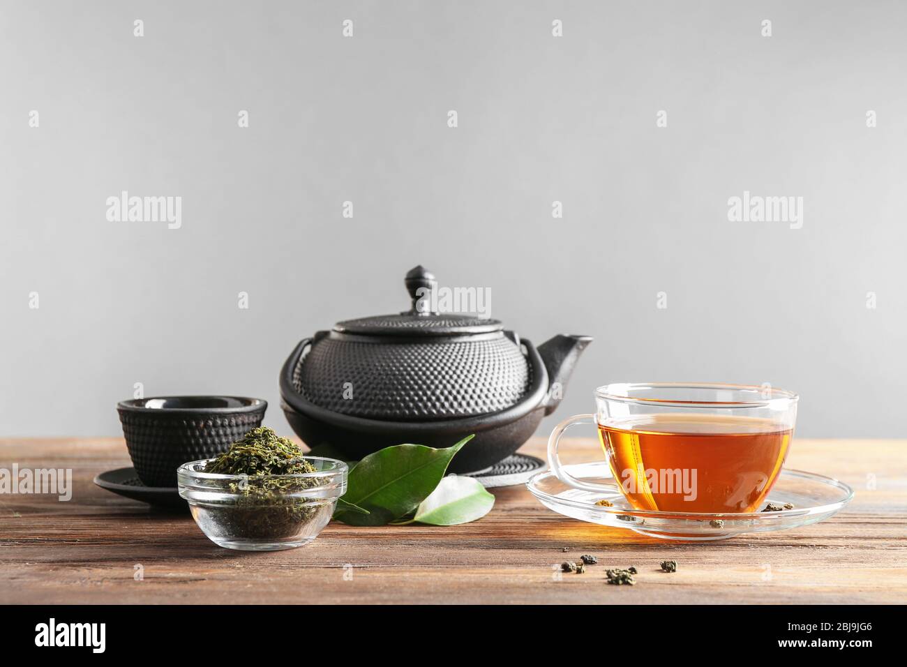 Traditional eastern teapot and teacup on wooden desk Stock Photo - Alamy