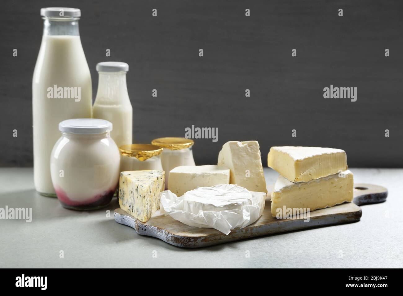 Dairy products on kitchen table Stock Photo - Alamy
