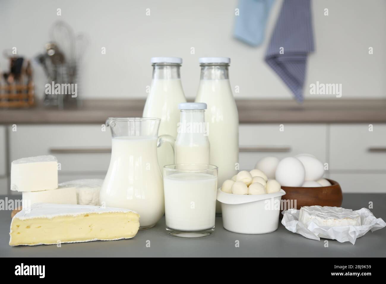 Dairy products on kitchen table Stock Photo - Alamy
