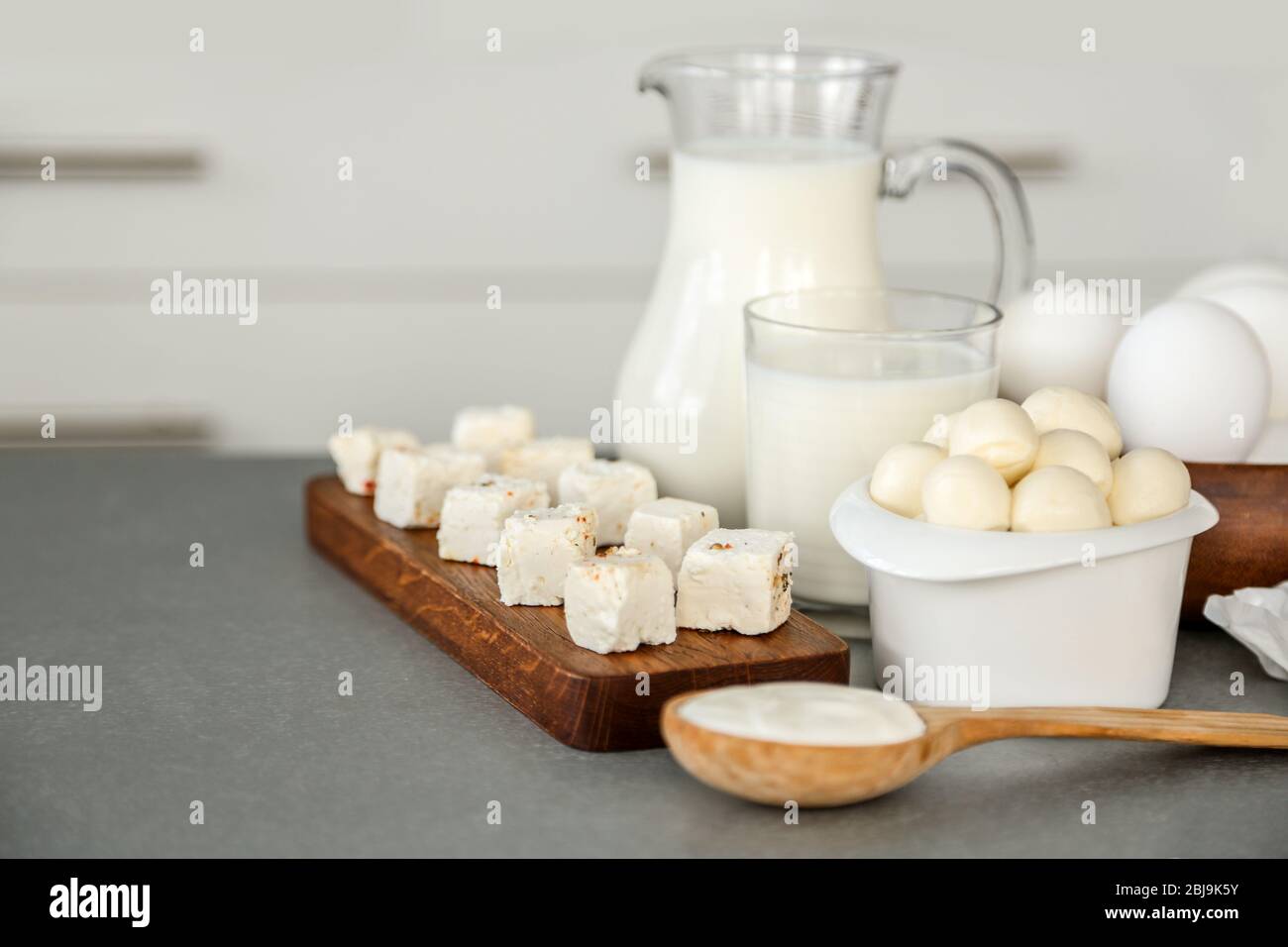 Dairy products on kitchen table Stock Photo - Alamy