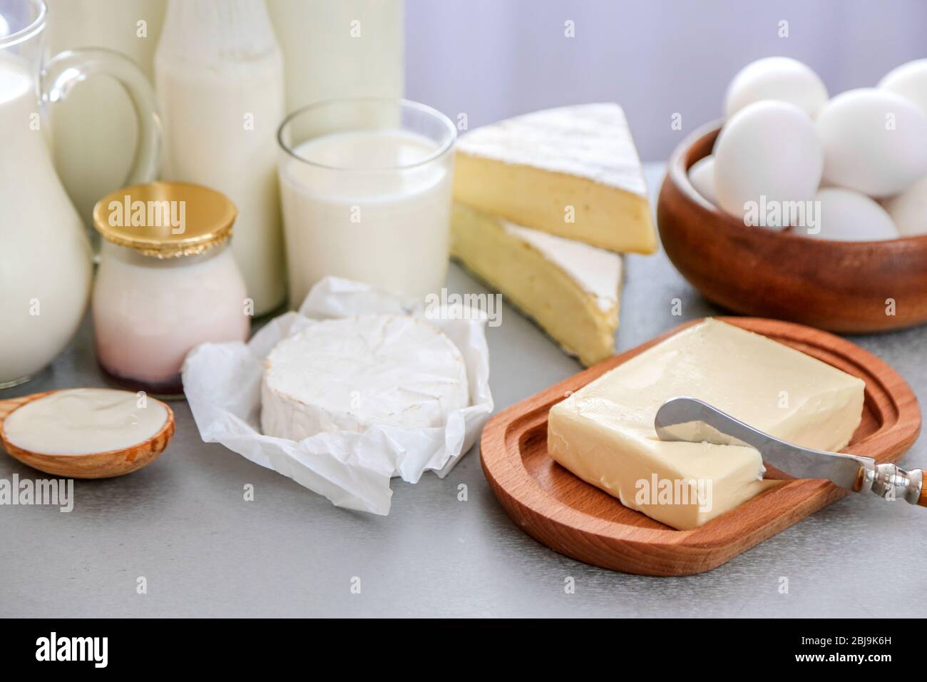 Dairy products on kitchen table Stock Photo - Alamy