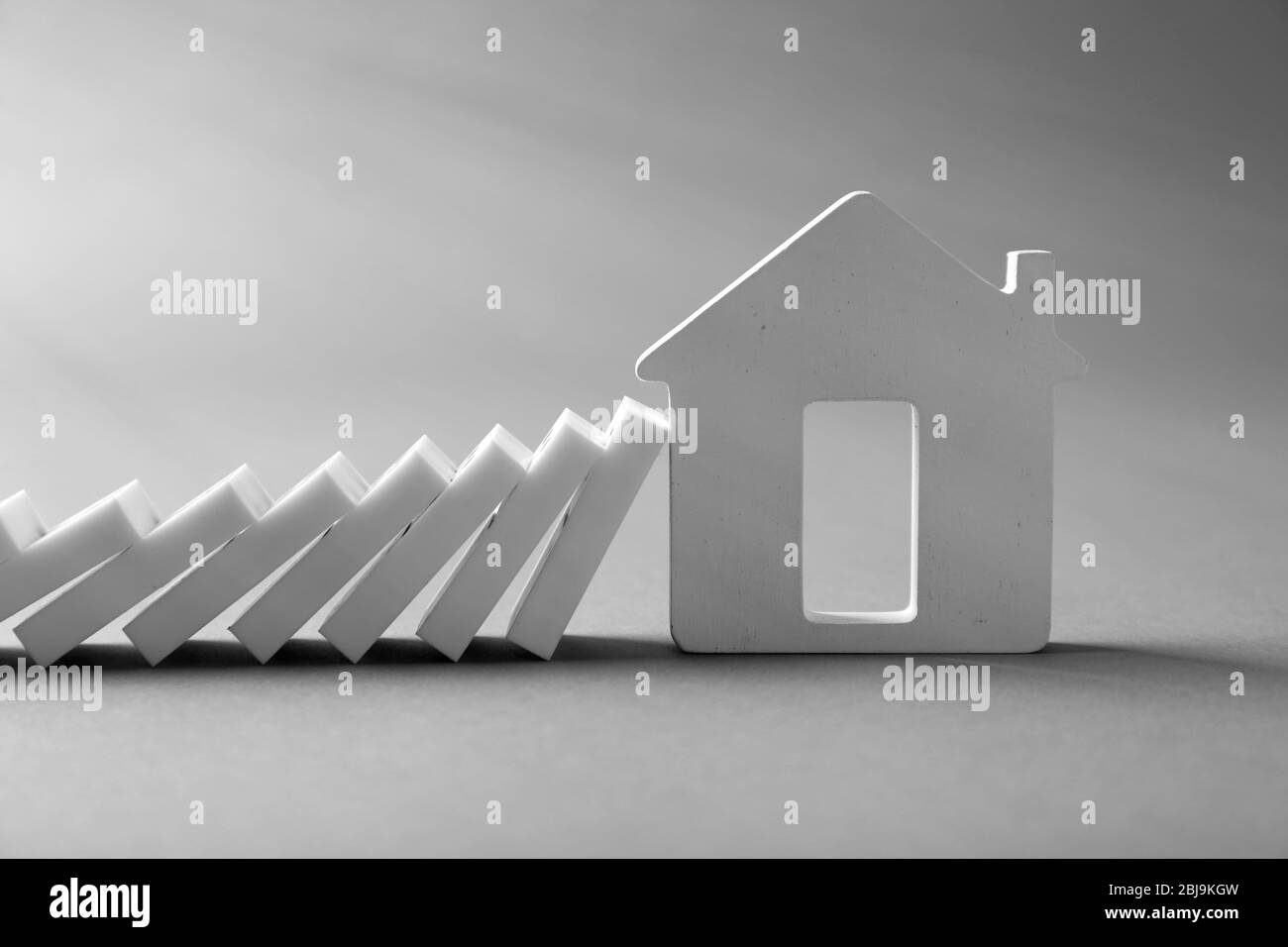 Dominoes with house shape on grey background Stock Photo - Alamy