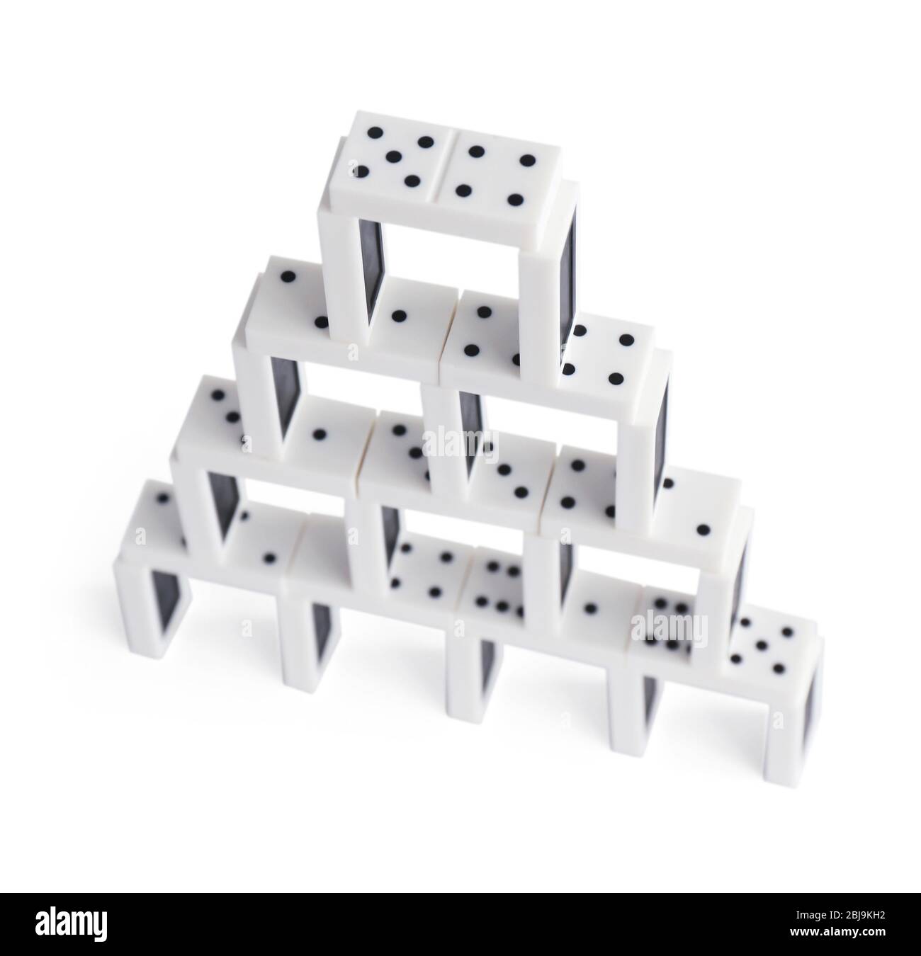 Tower of dominoes, isolated on white Stock Photo - Alamy