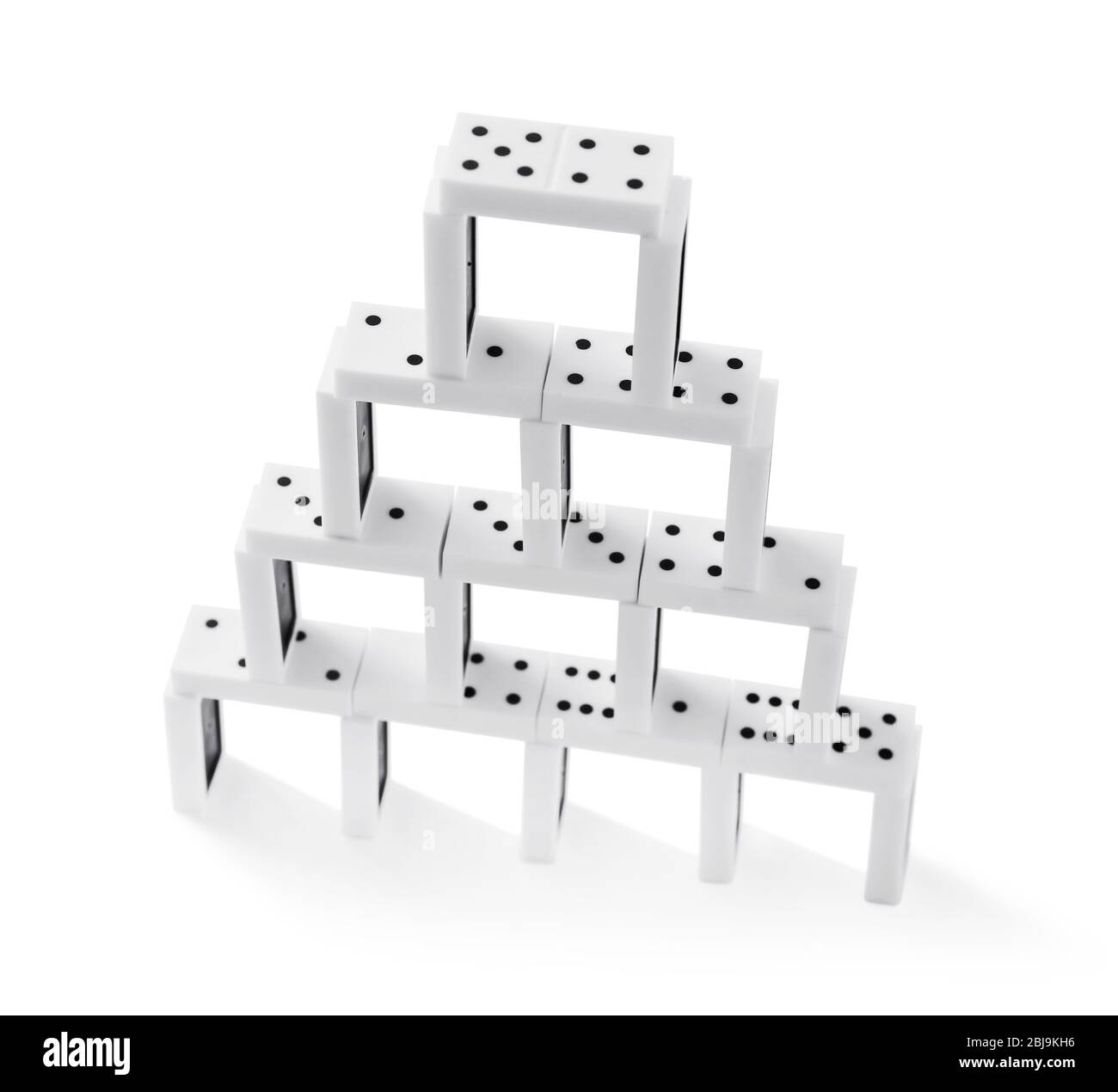Tower of dominoes, isolated on white Stock Photo - Alamy