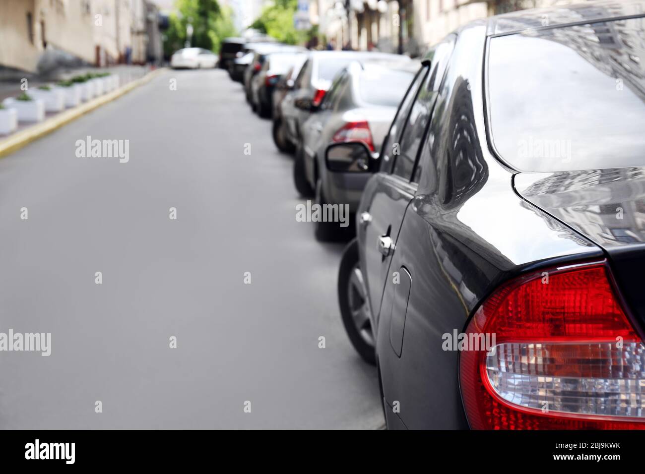 Cars parking near building Stock Photo - Alamy