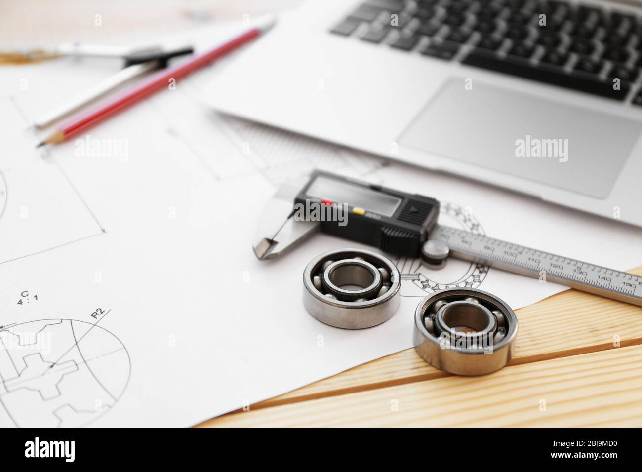 Engineering drawings of parts with tools closeup Stock Photo - Alamy