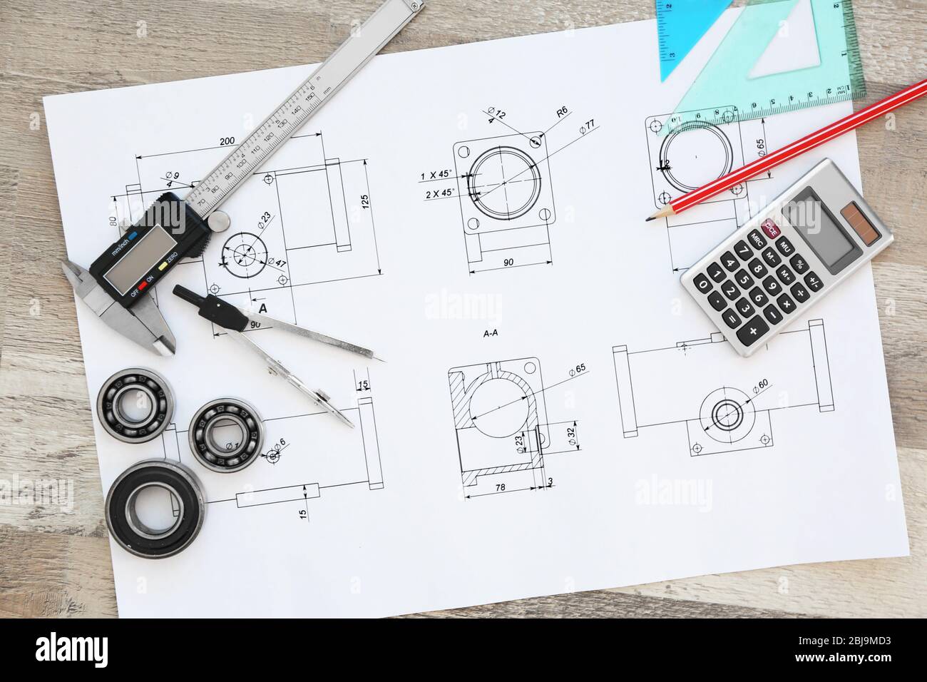 Engineering drawings of parts with tools, top view Stock Photo - Alamy