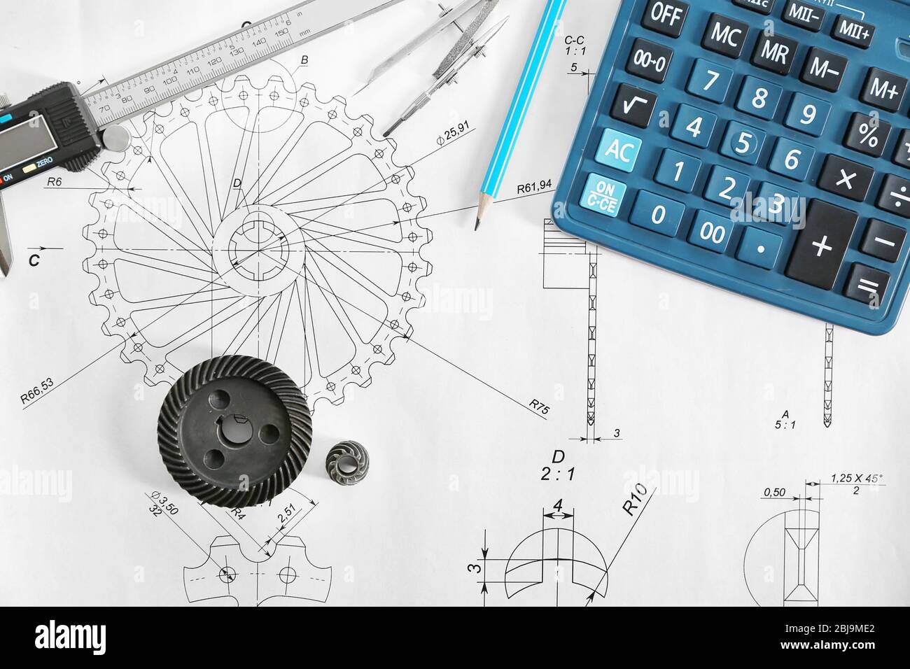 Engineering drawings of parts with tools, top view Stock Photo - Alamy