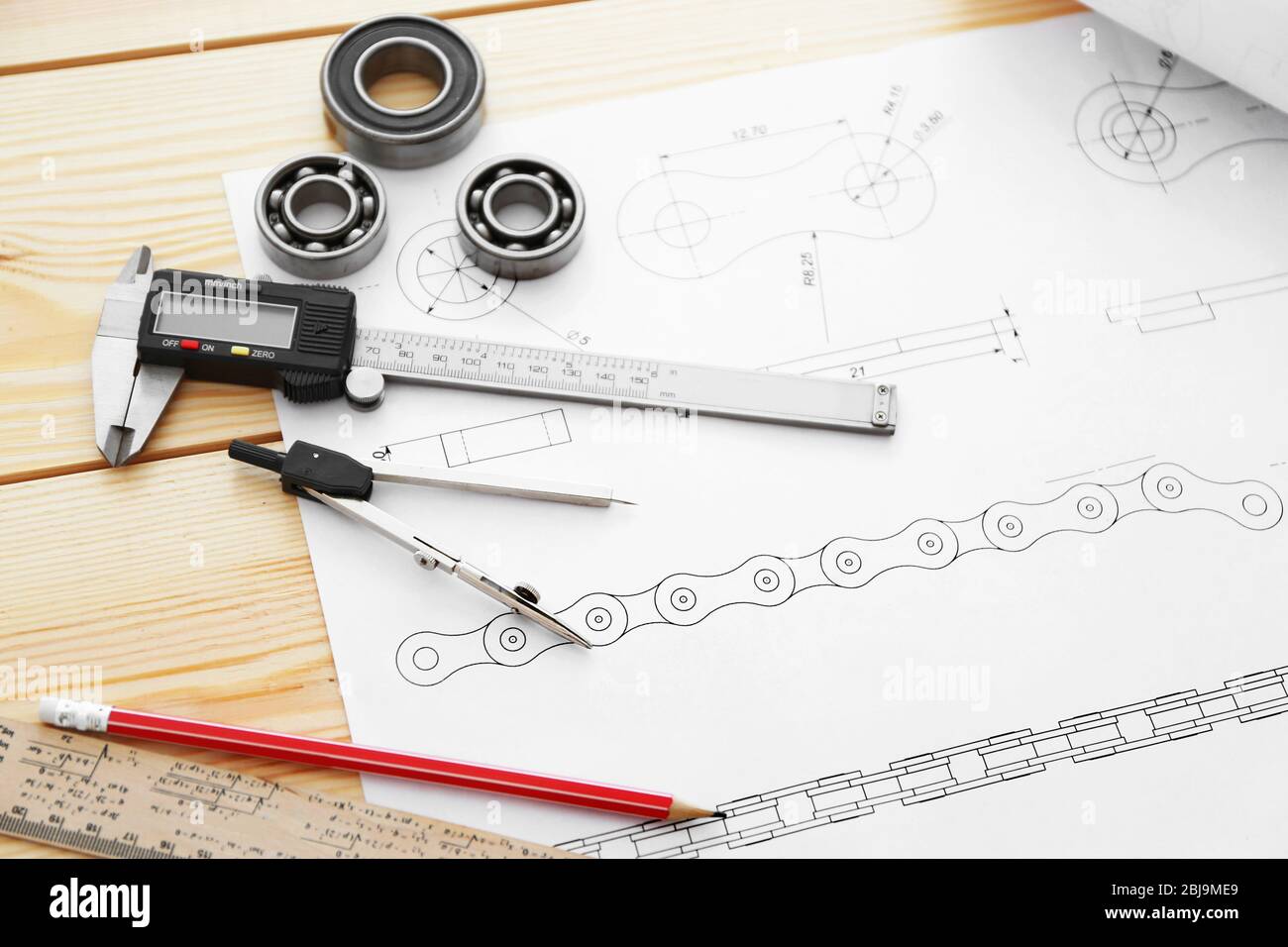 Engineering drawings of parts with tools closeup Stock Photo - Alamy