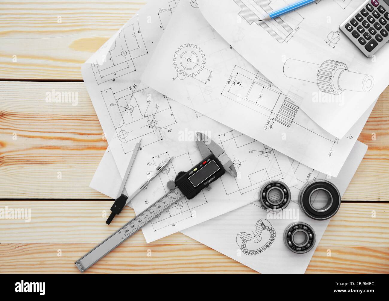 Engineering drawings of parts with tools, top view Stock Photo - Alamy
